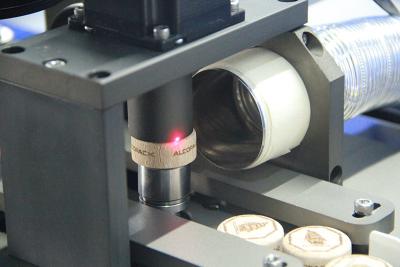 China Automatic CO2 Laser Marking Engraving Machine for Wood Bottle Cap Plug Stoppers for sale