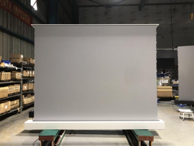 Electric floor-rising projector screen with sleek rectangular housing