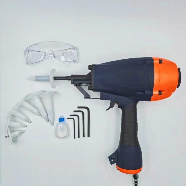 OuSen gas nail gun front view showing black and orange design