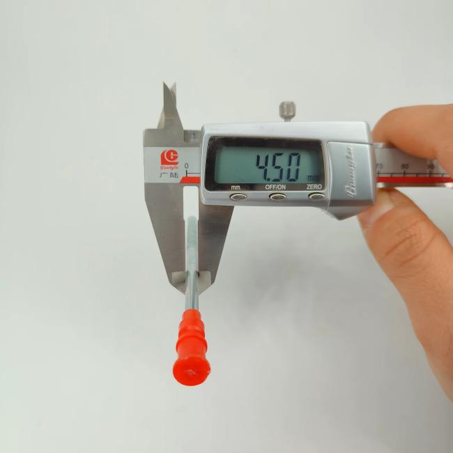 Different sizes of plastic insulation nails displayed together