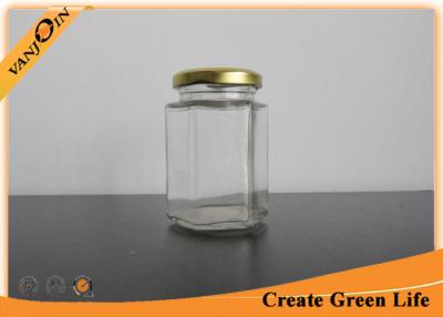 Cina L'alimento superiore d'avvitamento del vetro trasparente 200ml stona, contenitori di alimento di vetro di piccolo esagono con i coperchi in vendita