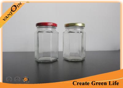 Cina La forma 220ml di esagono rimuove il barattolo di vetro del miele dell'alimento, piccoli barattoli di vetro riutilizzabili con i coperchi in vendita