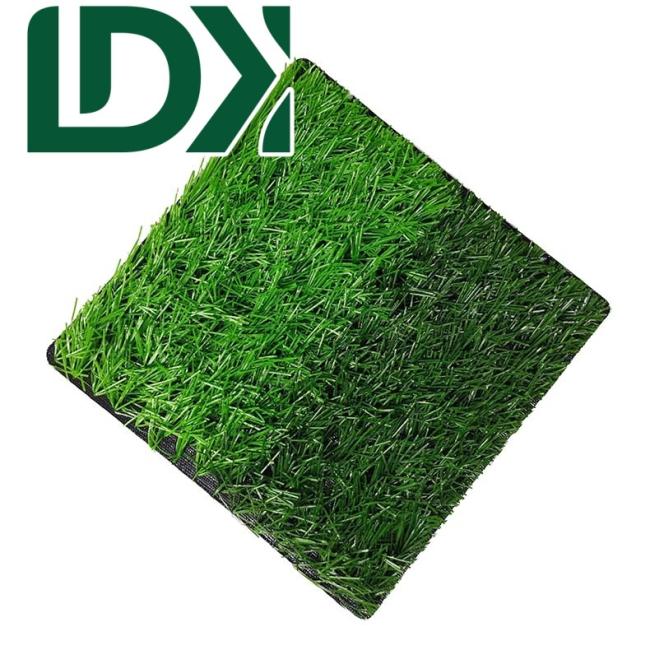 Artificial grass sample showing color variation