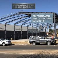 China Heavy Duty Steel Structure Workshop with Roll-up Door and Crane Beam System 8.0 Earthquake Resistant for sale