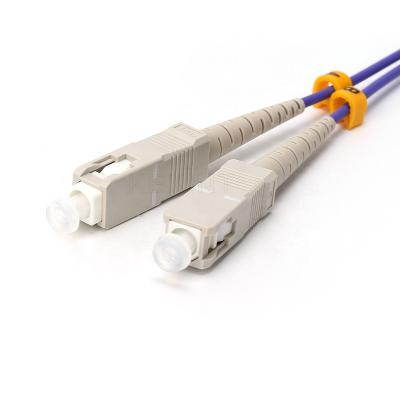Cina Colore porpora a fibra ottica duplex 50/125 2.0mm di millimetro OM2 del cavo di toppa dello Sc LC di KEXINT 3m LSZH in vendita