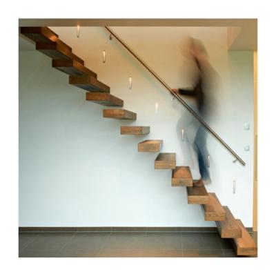 Cina Villa wood floating stairs factory customized black teak wood tread floating stair design in vendita