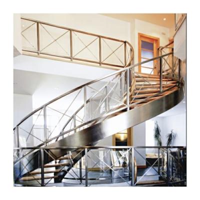 Cina Solid wood tread curved staircase with wrought iron spindles Canada curved iron stairway in vendita