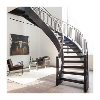 Cina Timber tread iron round staircase design South Sudan curved modern stairway in vendita