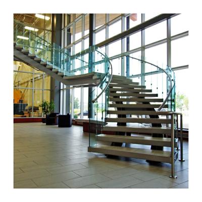 Cina Timber tread iron round staircase design South Sudan curved modern stairway in vendita