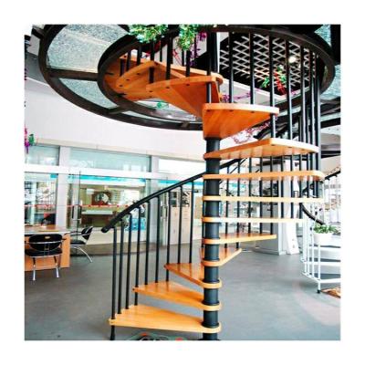 Cina Handrial bracket spiral staircase with wooden tread tempered glass tread spiral stairs in vendita
