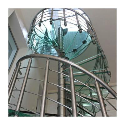 Cina China manufacturer steel structure staircase metal tempered glass spiral stairs in vendita