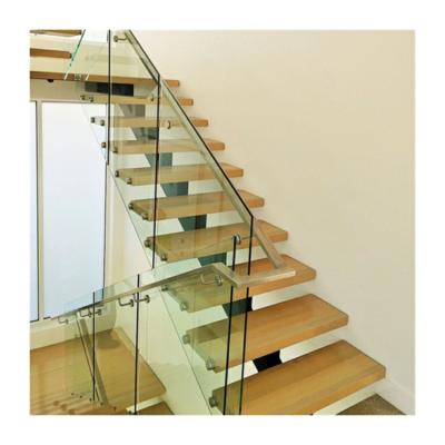 Cina Townhouse wood staircase with glass railing single stringer solid wood straight stair in vendita