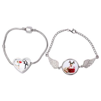 China Personalized Sublimation Angel Wings Bracelet Creative Souvenir Gift Sublimation Metal Charm Bracelets for sale