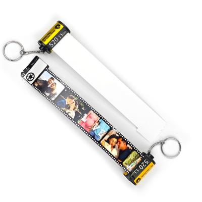 China Diy Sublimation Blank Memory Film Keychain Loving Memory Photo Film Roll Double Sided Sublimation Memory Keychains for sale