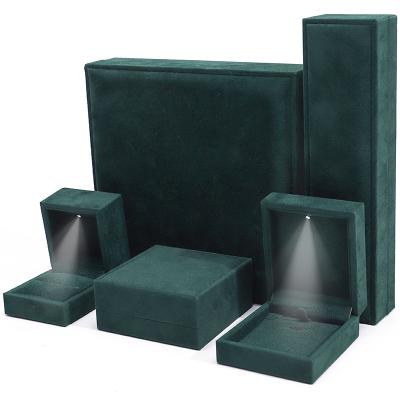 China Dark Green Soft Touch Velvet Luxury Jewelry Packaging Box with Shining LED Light for sale
