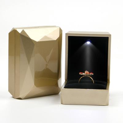 China Custom PU Plastic Jewelry Box with LED Light for Gold Packaging Display for sale