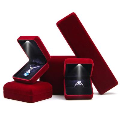 China LED Velvet Jewelry Box with Light Custom Hanhong Logo Embossed Luxury White Light Ring Box for sale
