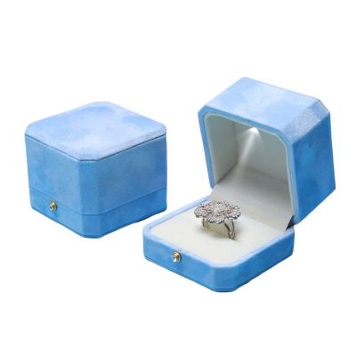 China Blue Velvet Octagonal LED Jewelry Box Custom Embossed Logo Packaging Solution for sale