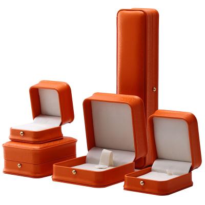 China Orange Snow Grain Noble PU Leather Jewelry Box for Luxury Storage Packaging for sale