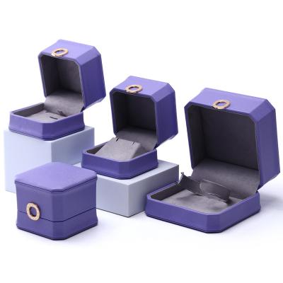 China Captivating Purple Octagonal PU Leather Jewelry Box for Ring Ear Studs Pendant for sale