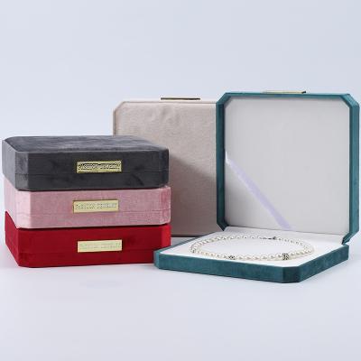 China Soft Touch Multi Color Velvet Pearl Necklace Storage Box With Golden Scutcheon for sale