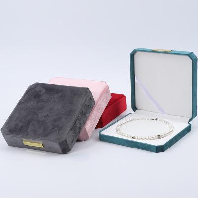 China Soft Touch Multi Color Velvet Pearl Necklace Storage Box With Golden Scutcheon for sale