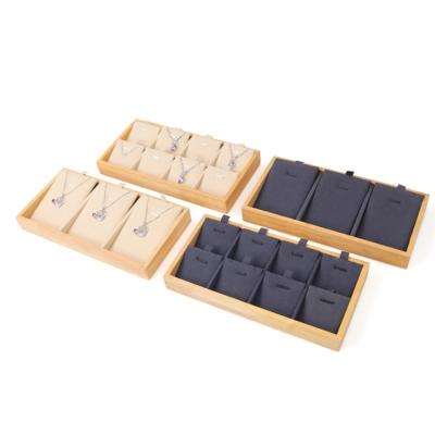 China Multiple Cells Solid Wood Pendant Storage Rack Luxury Necklace Display Tray for sale