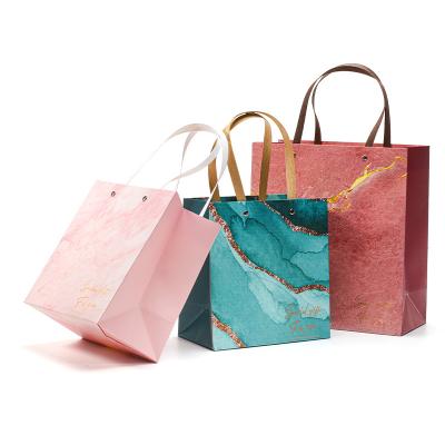 China Upscale Luxurious Firm Cardboard Paper Tote Bag Luxury Packaging With Handles for sale