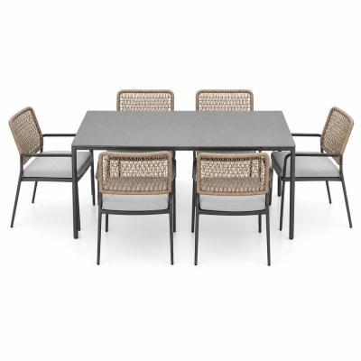 China Modern Outdoor Dining Set with Matte Gray Tabletop, Natural Tan PE Rattan Chairs, and Dark Gray Powder-Coated Frame for sale