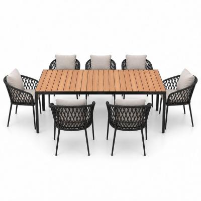 China Modern Outdoor Dining Set with Matte Gray Tabletop and Natural Tan PE Rattan Chairs on Dark Gray Powder-Coated Frame for sale