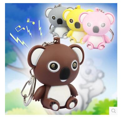 China New creative gift cartoon animal yellow duck led light keychain keyrings with sound for sale