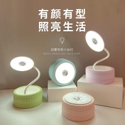 China Protect Eyesight Custom Business Gifts Tyre Shape Led Desk Reading Lamp for sale