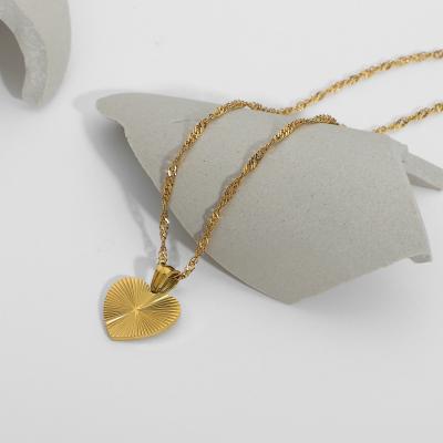 Cina Pendente di sigillo Sunburst per donne Cuore in acciaio inossidabile farfalla Disco di luce solare Choker moneta in vendita