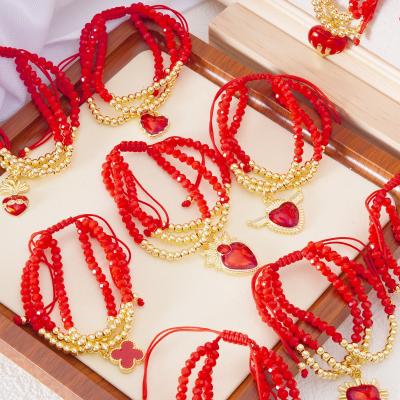 Cina Braccialetti con perline con ciondolo a cuore alla moda Oro Rosso Impermeabile Ottone Placcato Oro Braccialetti con perline con ciondoli in vendita
