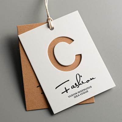 Cina abbigliamento di carta di 250-350gsm CMYK Hang Tag Different Shape For in vendita