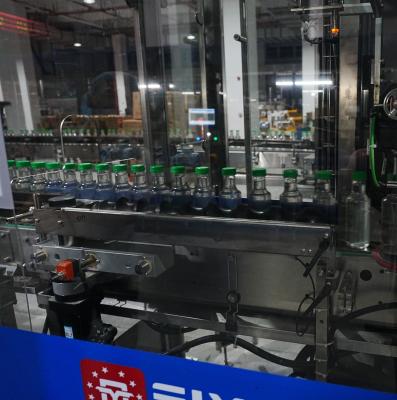 China Automatic Double-Head Sleeve Labeling Machine 9000-72000bph for sale