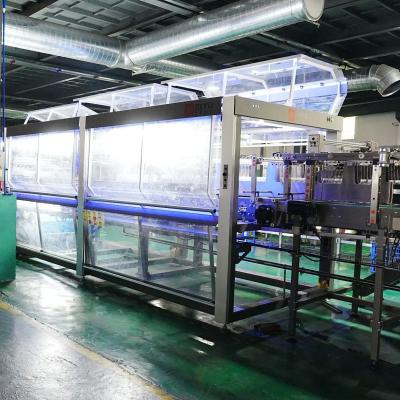 China Full Automatic Heat Shrink Film Packaging Machine with Stainless Steel Heating for 12,000 to 48,000 Bottles/Hour for sale