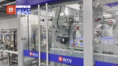Carton wrapping machine used at a customer's site for a bottled mineral water production line