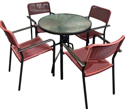 China Steel K / D Glass Round Table And Plastic Wicker Chairs Dining Set 5 for sale
