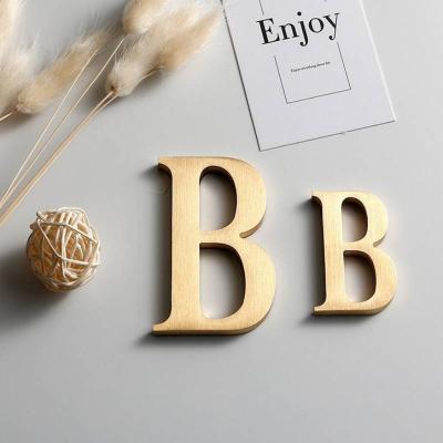 China Factory Wholesale Golden Brushed Stainless Steel Commercial Letter Signs Self-adhesive Solid Metal Letter Mall Hotel Signs for sale