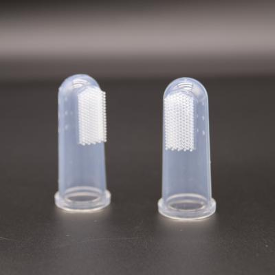 Cina spazzolino da denti per denti per bambini in silicone di colore trasparente di qualità alimentare pulizia orale in vendita