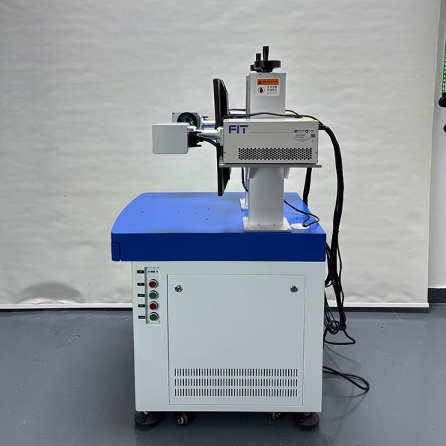 Dual-head laser marking machine in industrial setting