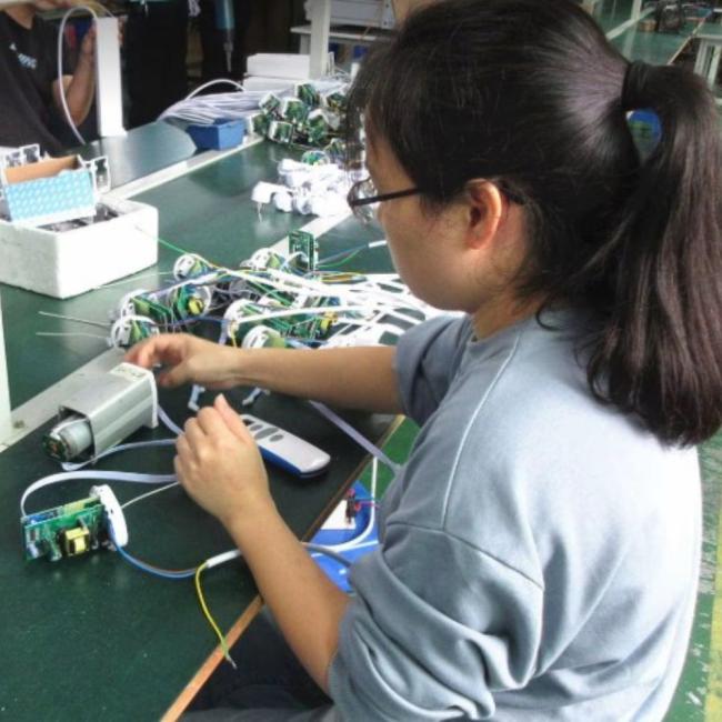 Workers are manufacturing high-quality curtain motors
