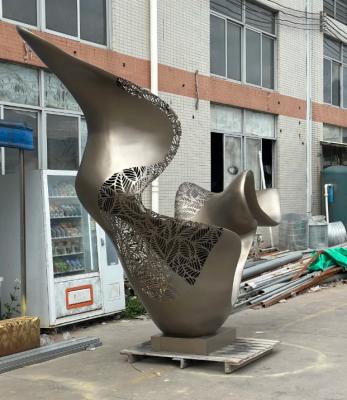 China Laser Cut Leaf Pattern Abstract Metal Sculpture With Wave Design Modern Stainless Steel Art for sale