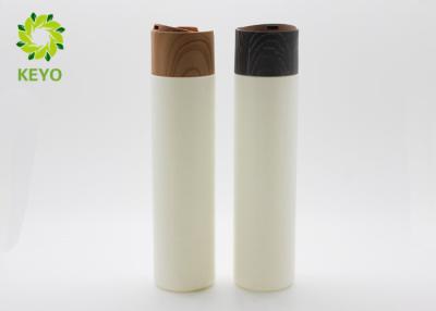 Cina 8 bottiglie cilindriche dello sciampo e del balsamo di OZ con il cappuccio di legno della stampa di colore in vendita