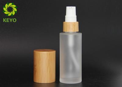 中国 白いポンプを搭載するタケ帽子のスキン ケアの空の化粧品のびんの曇らされたガラス ビン 販売のため