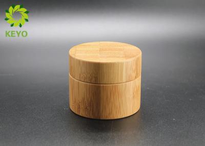 中国 ブラウン色の化粧品のクリーム色の瓶、タケ材料が付いているガラス化粧品の瓶 販売のため