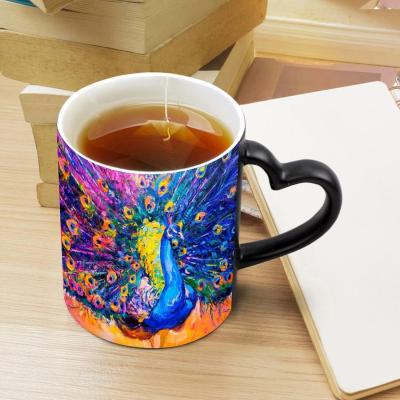 中国 Ceramic Heat Sensitive Coffee Cups Discoloration Cup with Heart Shaped Handle Gifts heat changing mug 販売のため