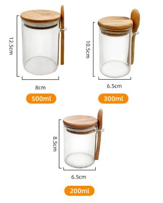 Cina Cibo Bottine rotonde di vetro di bambù con coperchio e cucchiaio Caramelle Spezie Caffè Fagioli Noci Biscotti in vendita