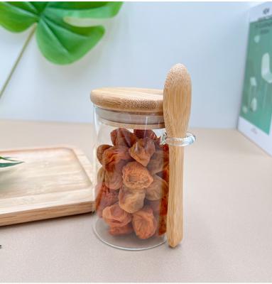 Cina Cibo Bottine rotonde di vetro di bambù con coperchio e cucchiaio Caramelle Spezie Caffè Fagioli Noci Biscotti in vendita